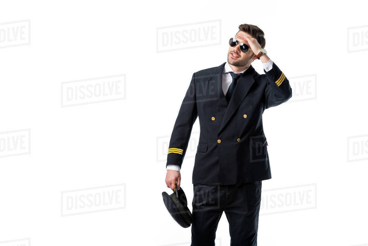 Portrait of young pilot in sunglasses looking away isolated on white ...