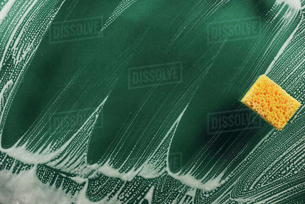 Top view of washing sponge and foam on dirty surface - Royalty-free ...