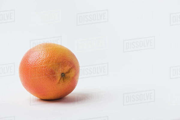Raw unpeeled orange laying on white background - Royalty-free Stock ...