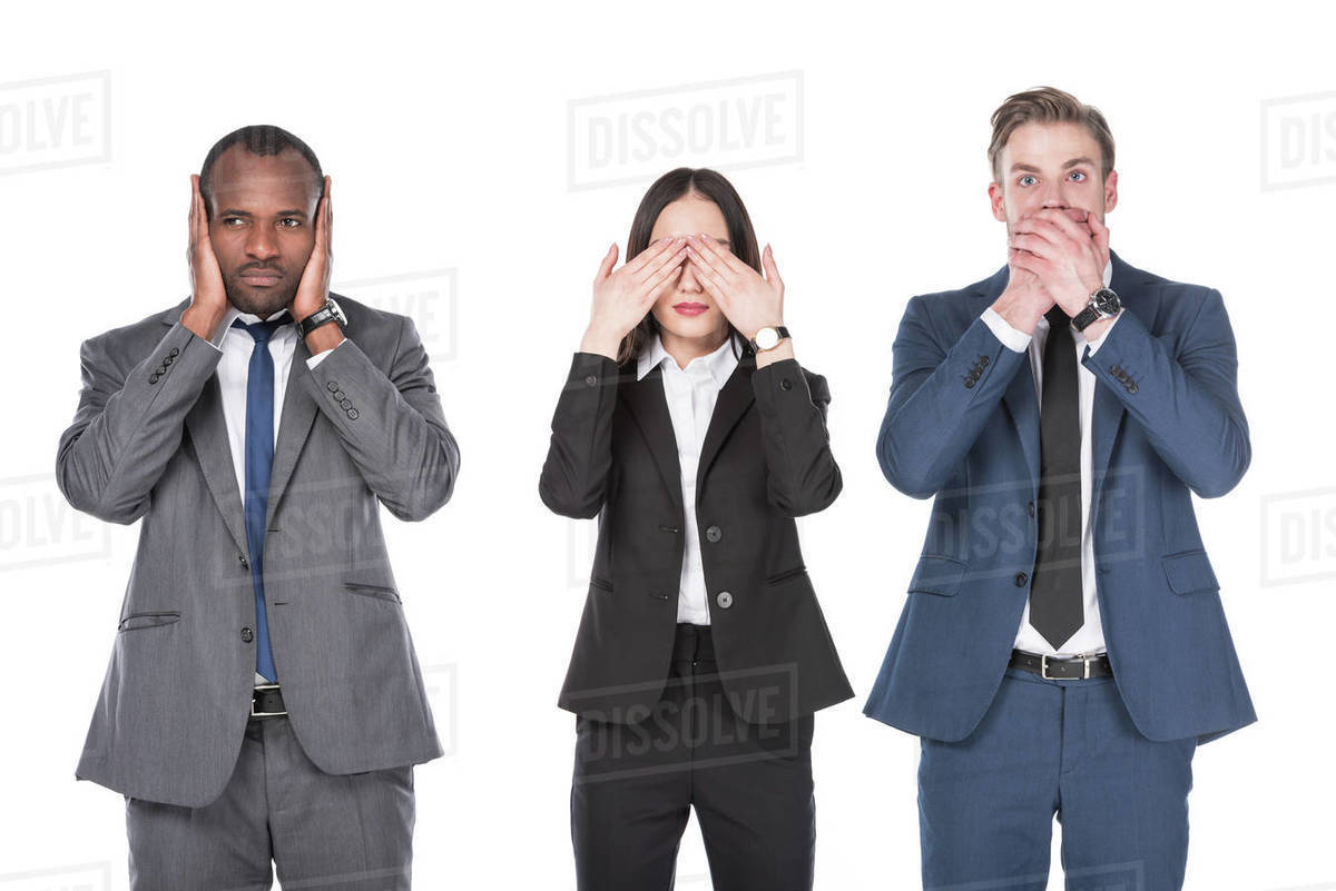 Portrait of multicultural young business people covering parts of faces ...