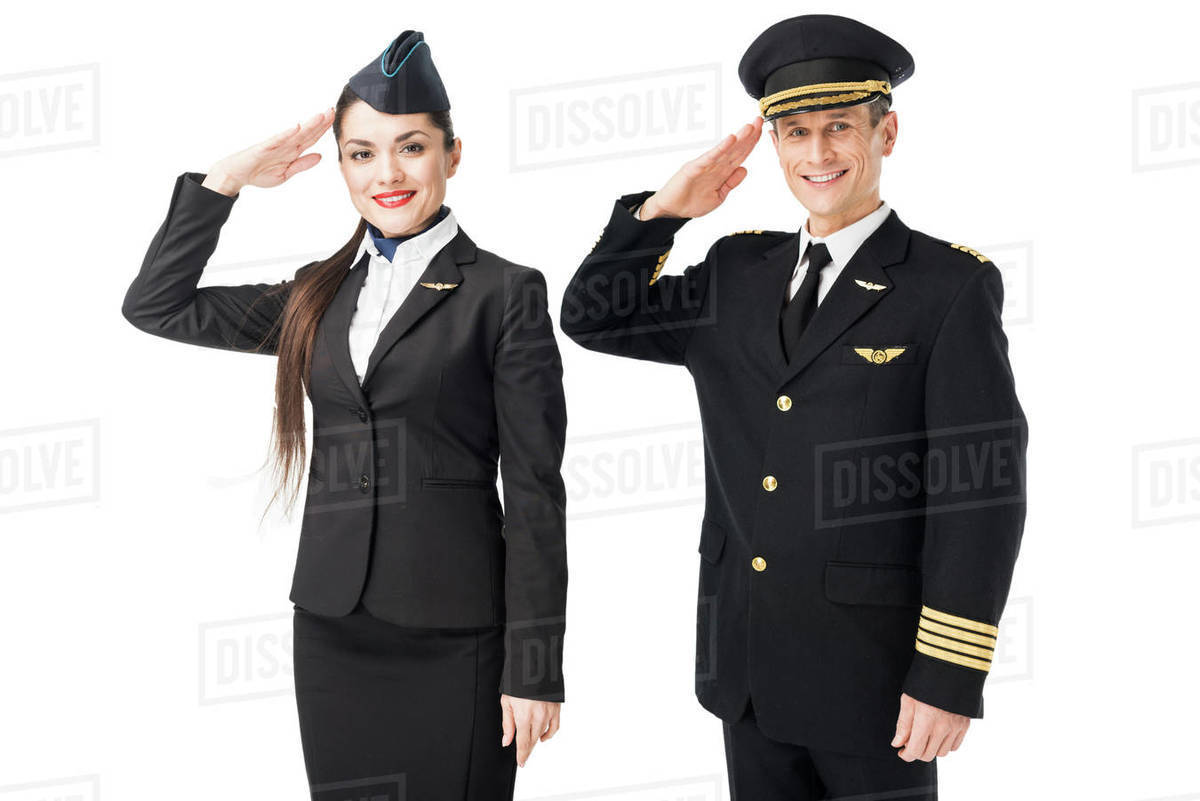 Airline captain and stewardess saluting isolated on white - Royalty ...