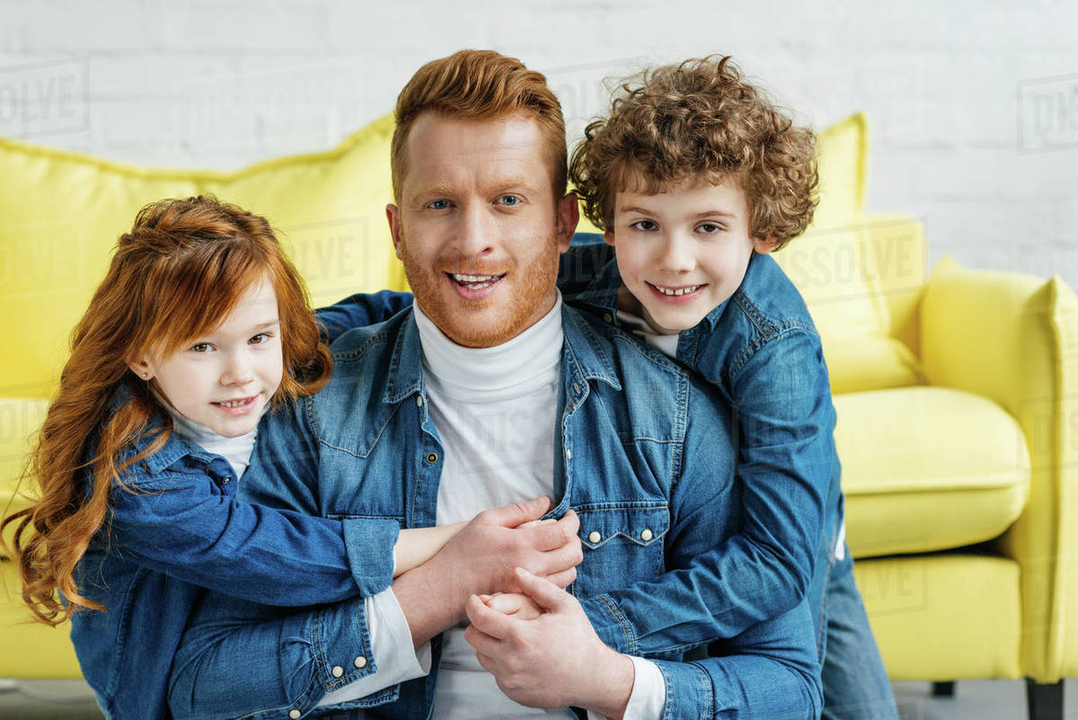 Cute children hugging their young father - Royalty-free Stock Photo ...