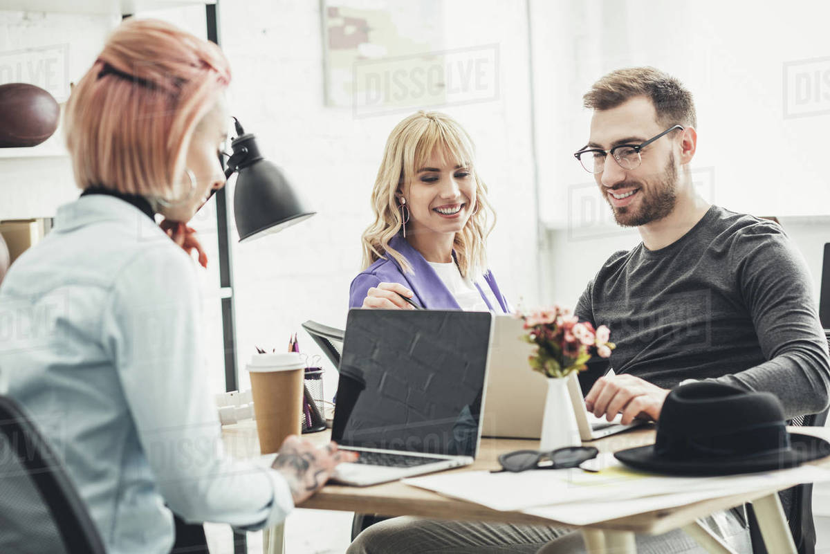 Selective focus of young creative workers working on new idea in office ...