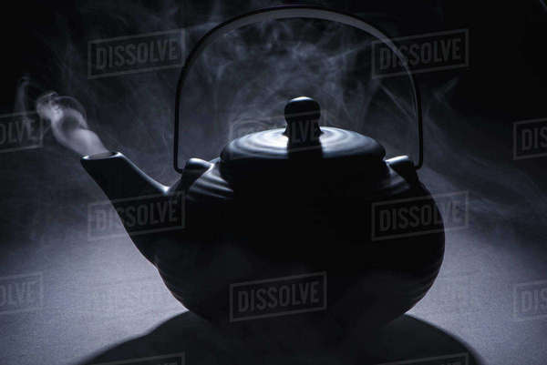 Close-up view of black Chinese teapot with hot steam on black - Stock ...