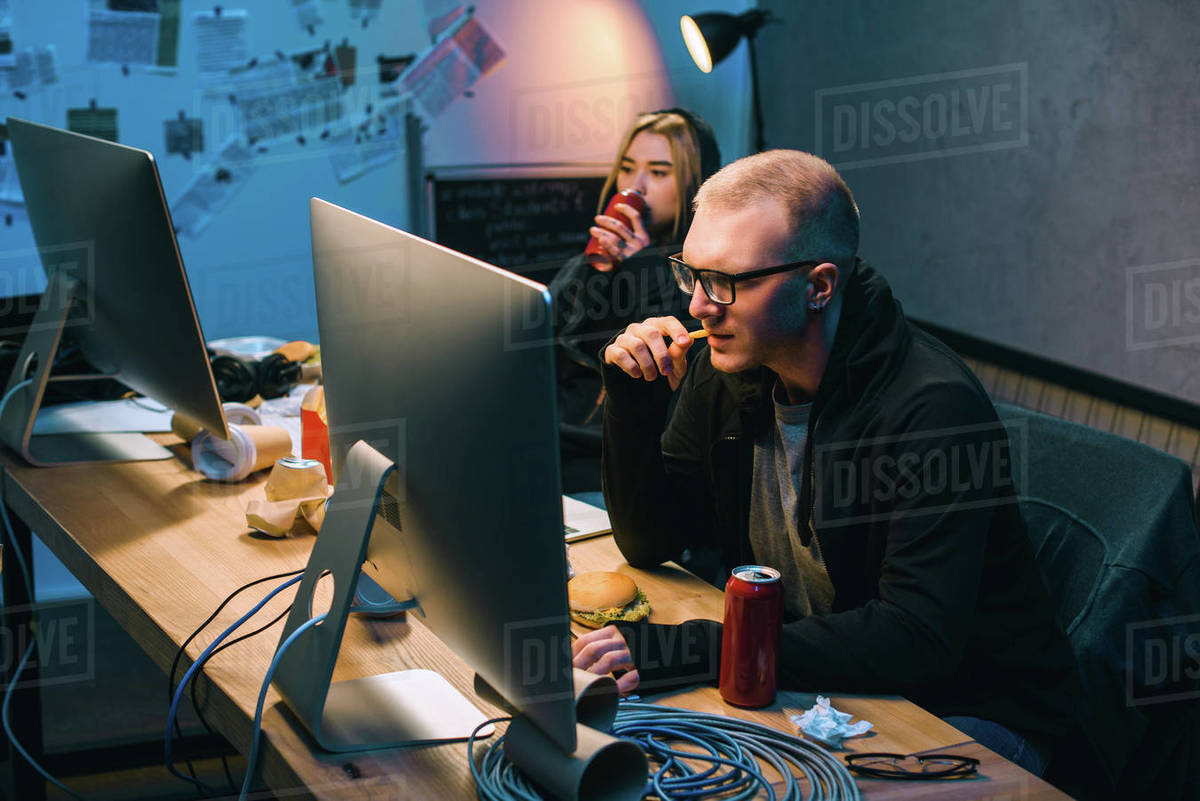Hackers drinking beer and eating junk food while working on malware ...
