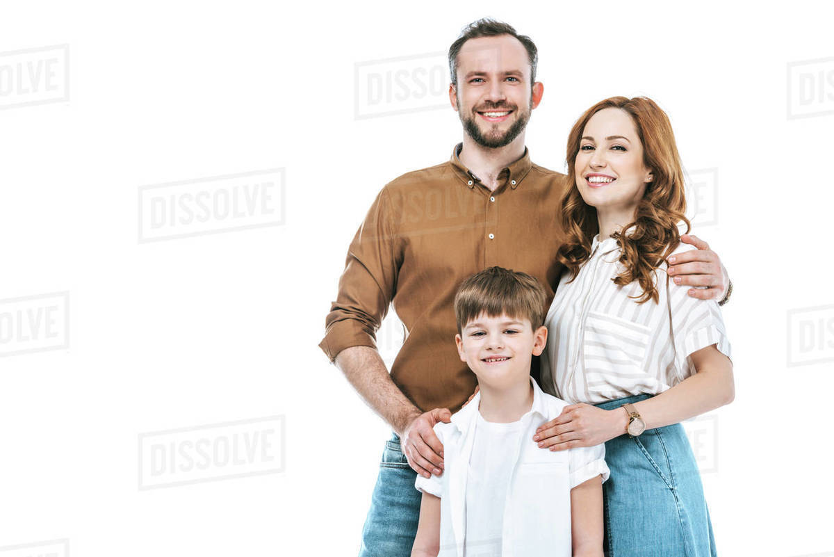 Beautiful happy family with one kid standing together and smiling at ...