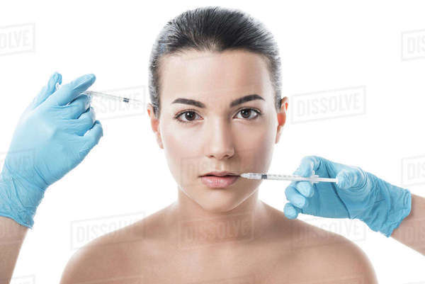 Cosmetologists making beauty injections for beautiful girl isolated on ...