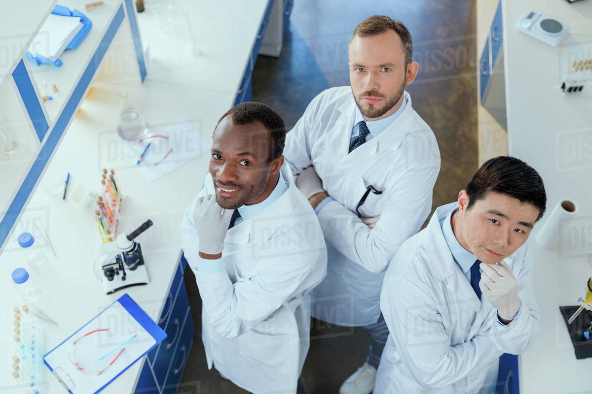 High angle view of multiracial group of scientists standing together in ...