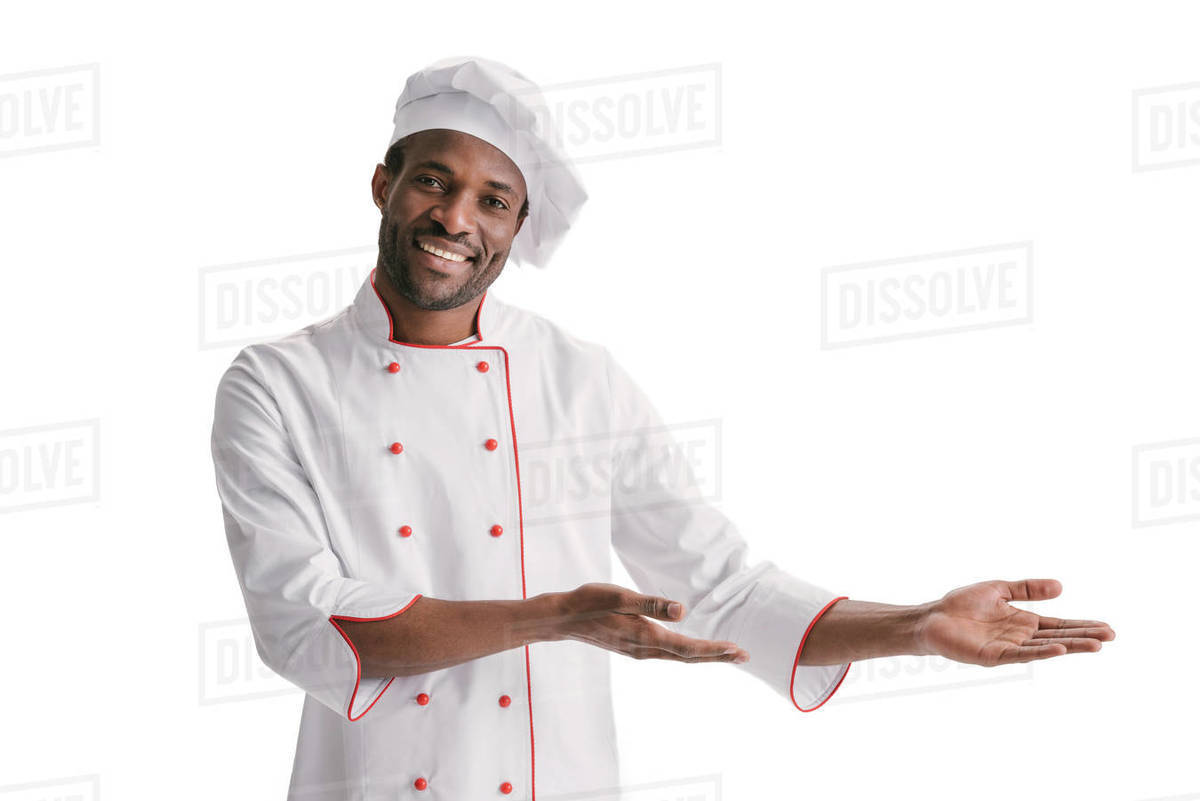 Happy african-american chef doing presentation on copy space isolated ...