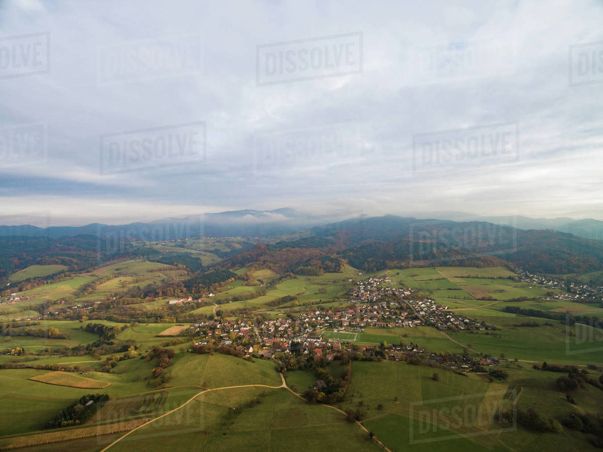 Aerial view of beautiful green hills, trees and buildings, Germany ...