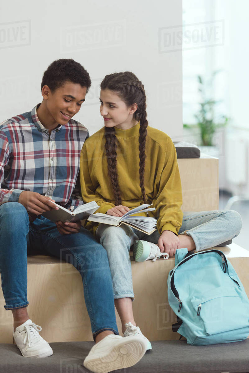 Happy high school students couple doing homework together - Royalty ...