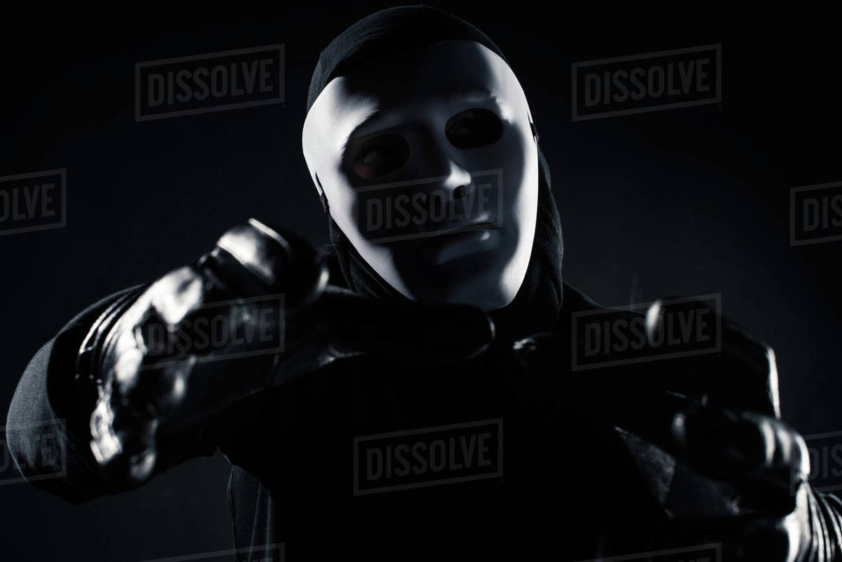 Man in mask reaching to the camera with his hands - Royalty-free Stock ...