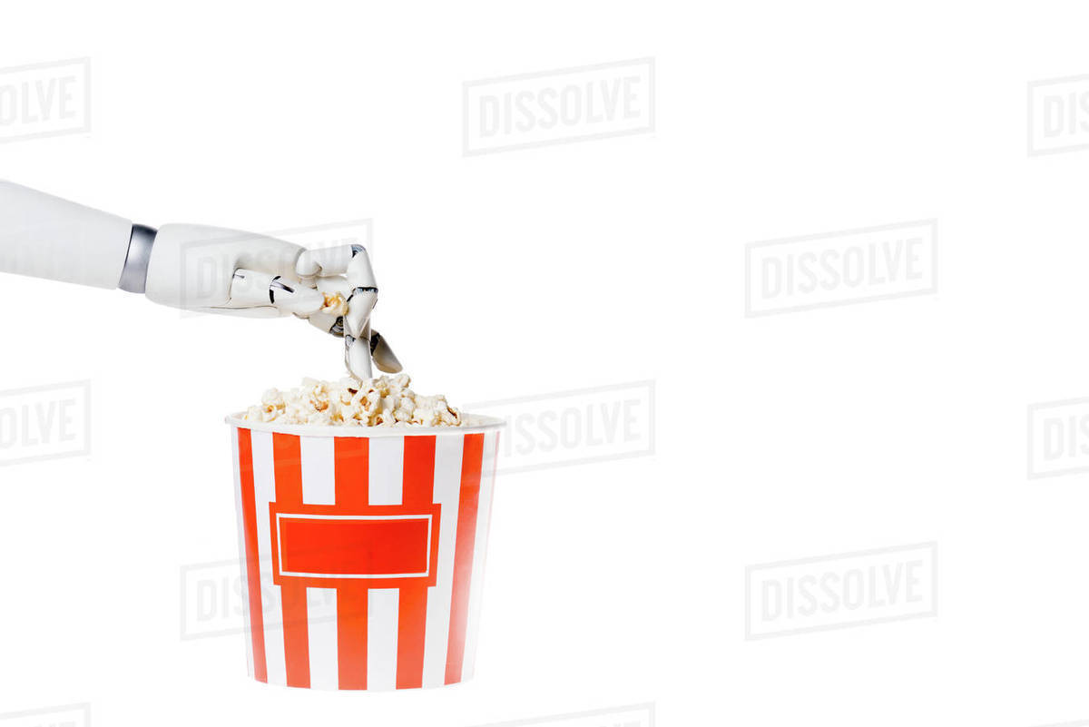 Cropped shot of robot taking popcorn out of bucket isolated on white ...