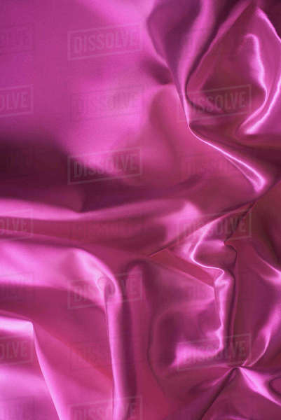 Crimson shiny silk fabric background - Stock Photo - Dissolve