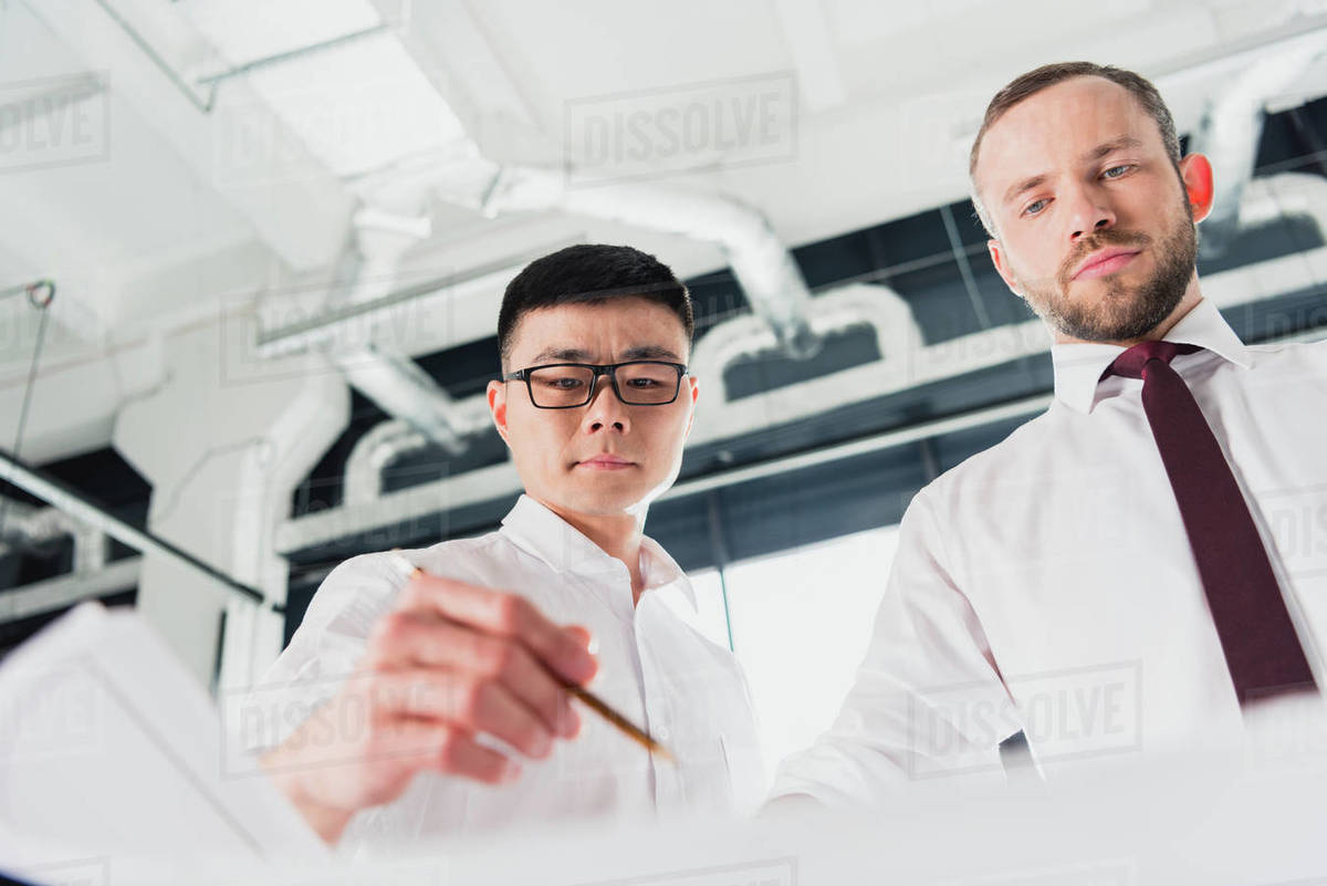 professional architects in formal wear working at modern office ...