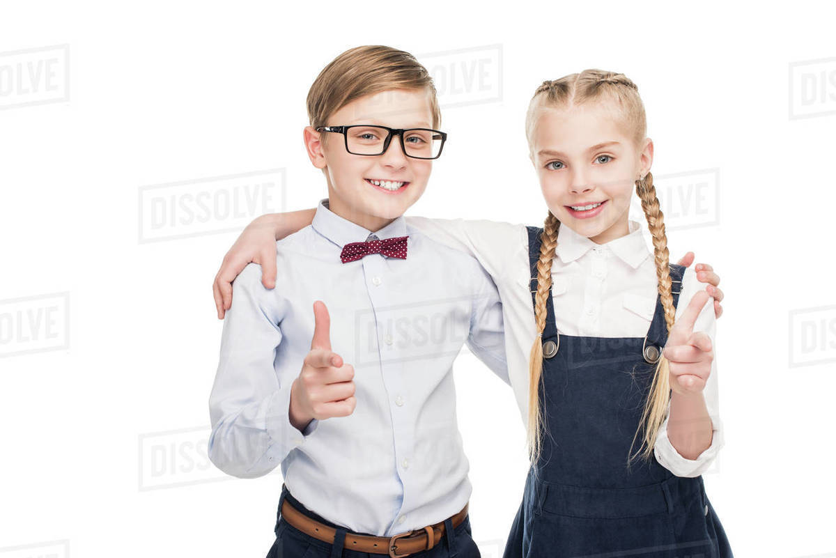 Happy children pointing with fingers and smiling at camera isolated on ...