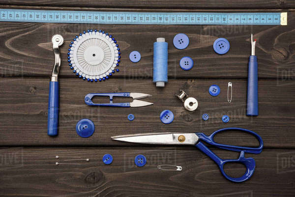 Top view of set of various sewing supplies on wooden surface - Royalty ...