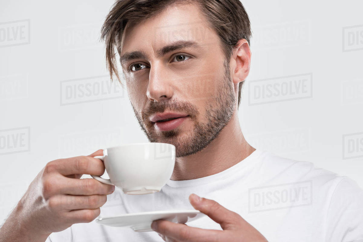 Handsome man drinking aromatic coffee, isolated on white - Royalty-free ...