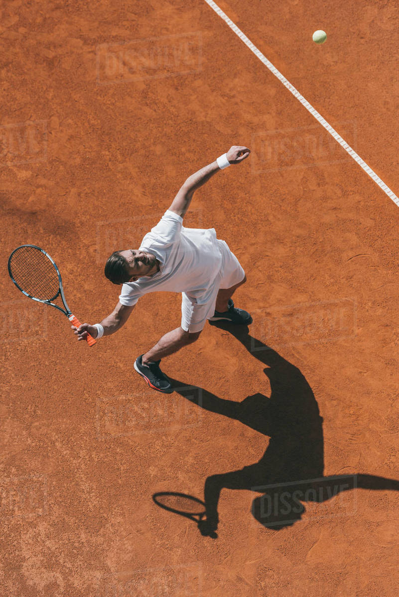 High angle view of man making hit with tennis racket - Royalty-free ...