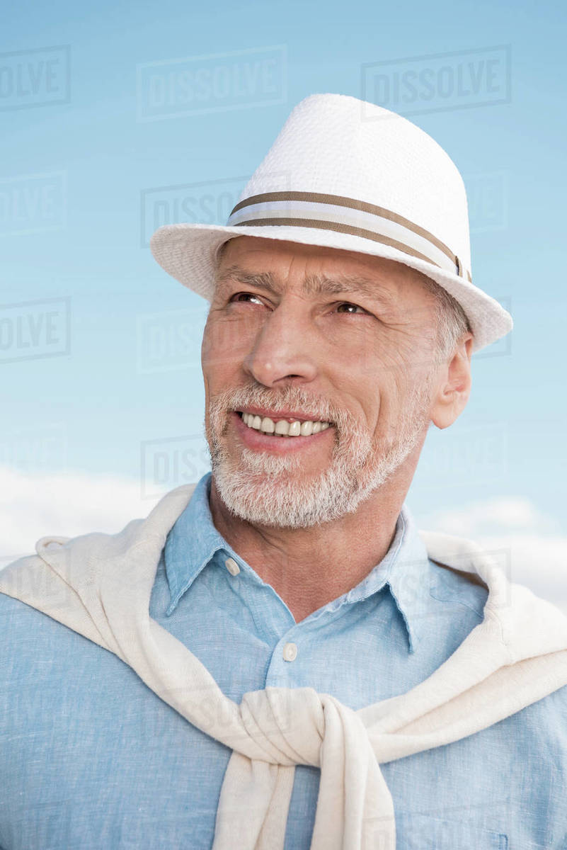 portrait of grey haired stylish man smiling and looking away - Stock ...