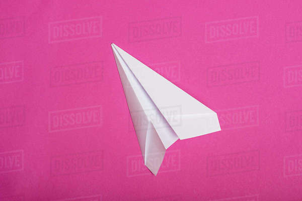 Top view of white paper plane isolated on pink - Royalty-free Stock ...