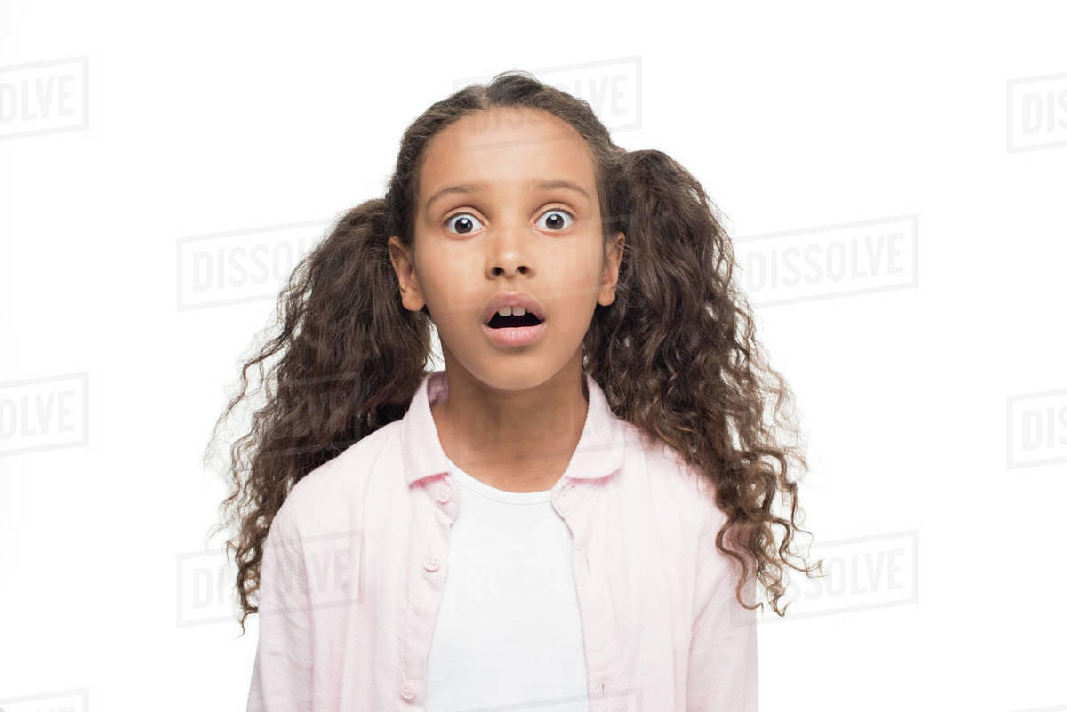 Shocked little girl looking at camera isolated on white - Royalty-free ...
