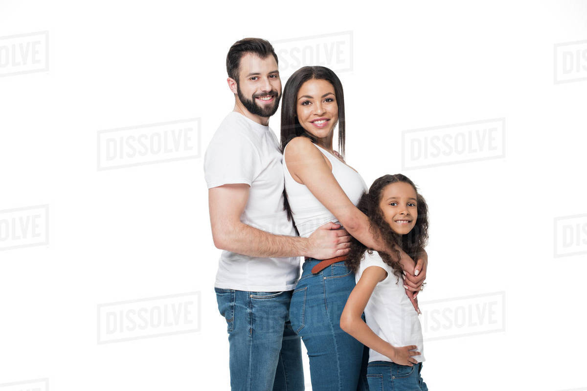 Side view of cheerful multiethnic family standing in line together ...
