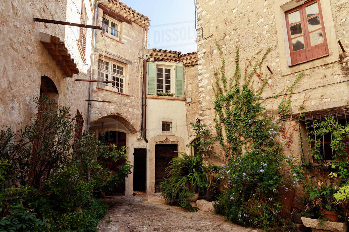 Facades of ancient stone buildings at old european town, Antibes ...
