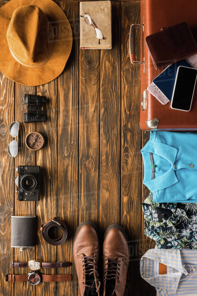 frame made of vintage suitcase with baggage for travel on wooden ...
