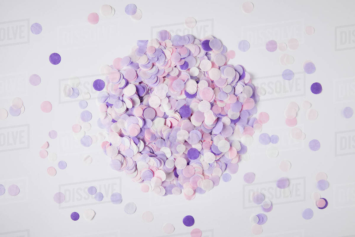 Top view of pile of violet confetti pieces on white surface - Stock ...