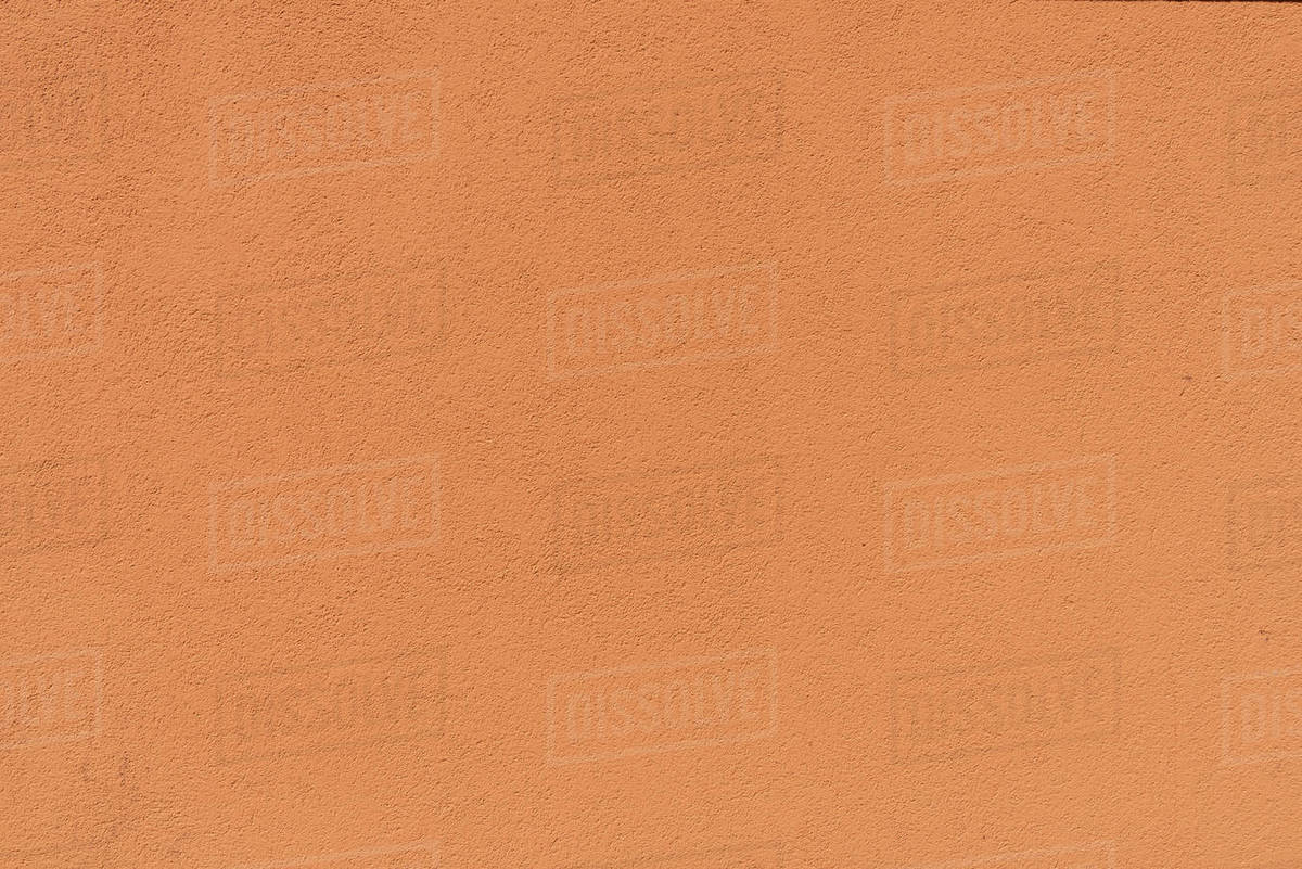 Close-up view of orange rough weathered textured background - Royalty ...