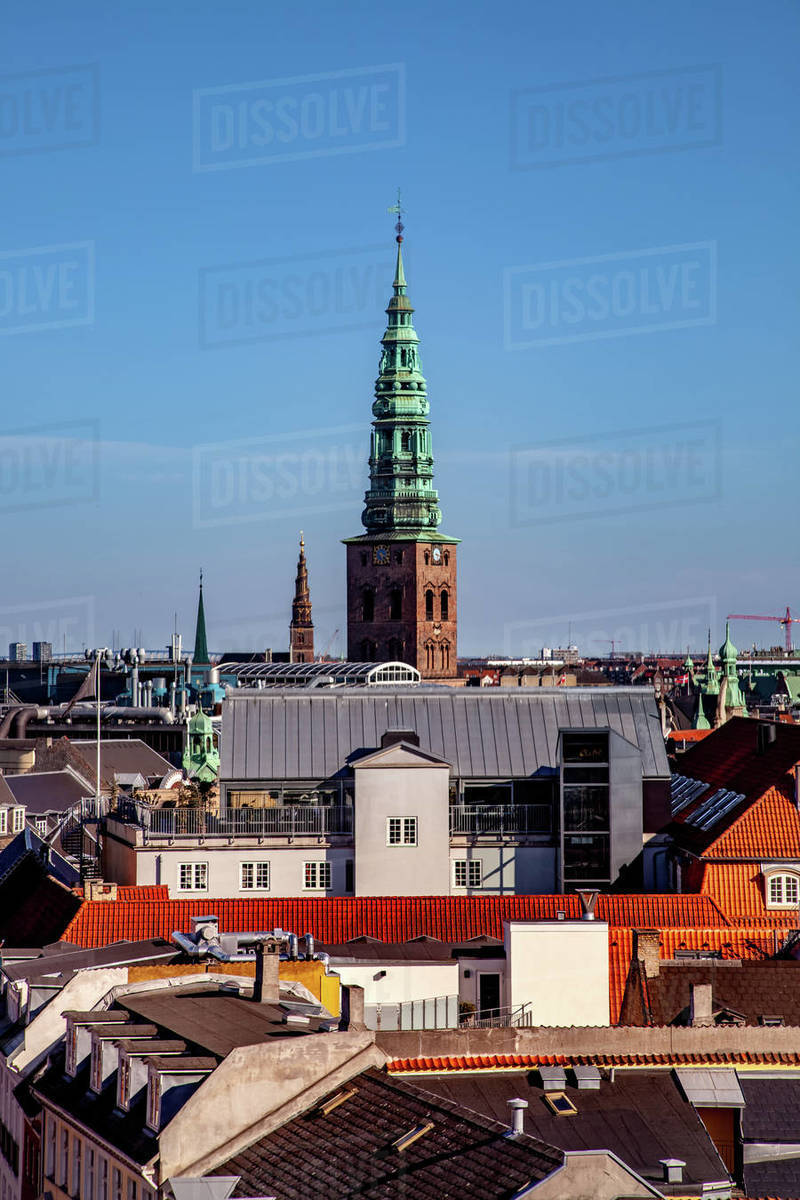 Aerial view of old tower with tall spire and cityscape in copenhagen ...