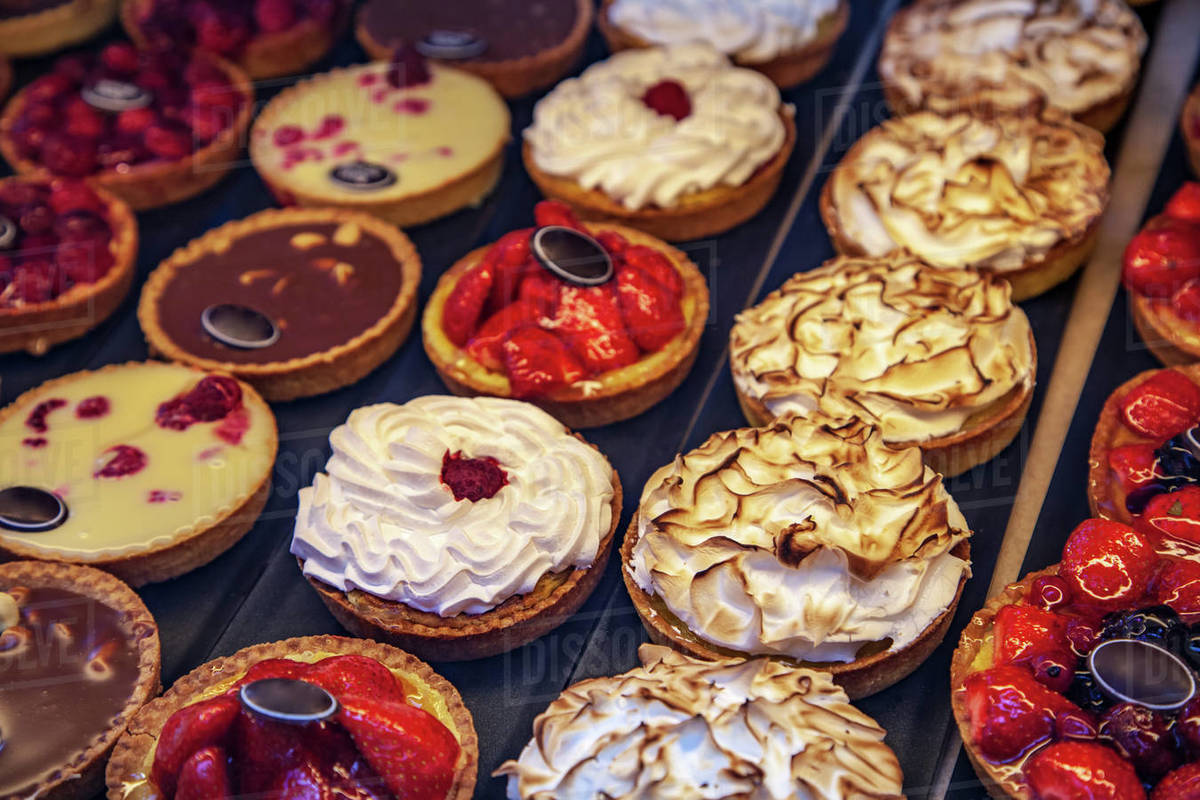 Close up view of different cakes placed in rows - Royalty-free Stock ...