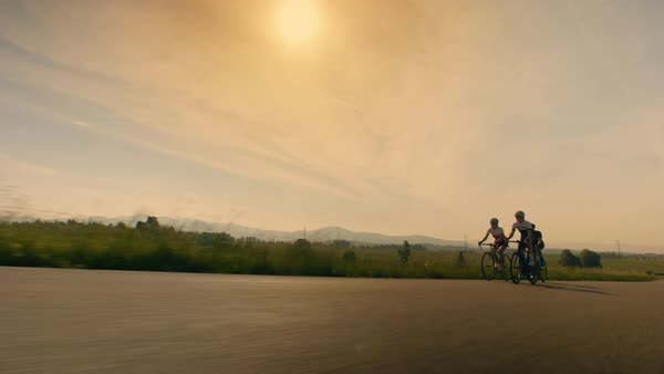 Low angle, tracking shot of group of road bikers - Stock Video Footage ...