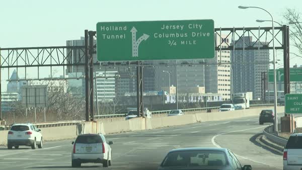 Wide shot of freeway signs in Jersey City. - Stock Video Footage - Dissolve
