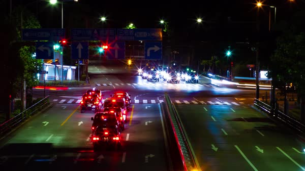 A night timelapse of traffic jam at the city street in Aoyama long shot ...