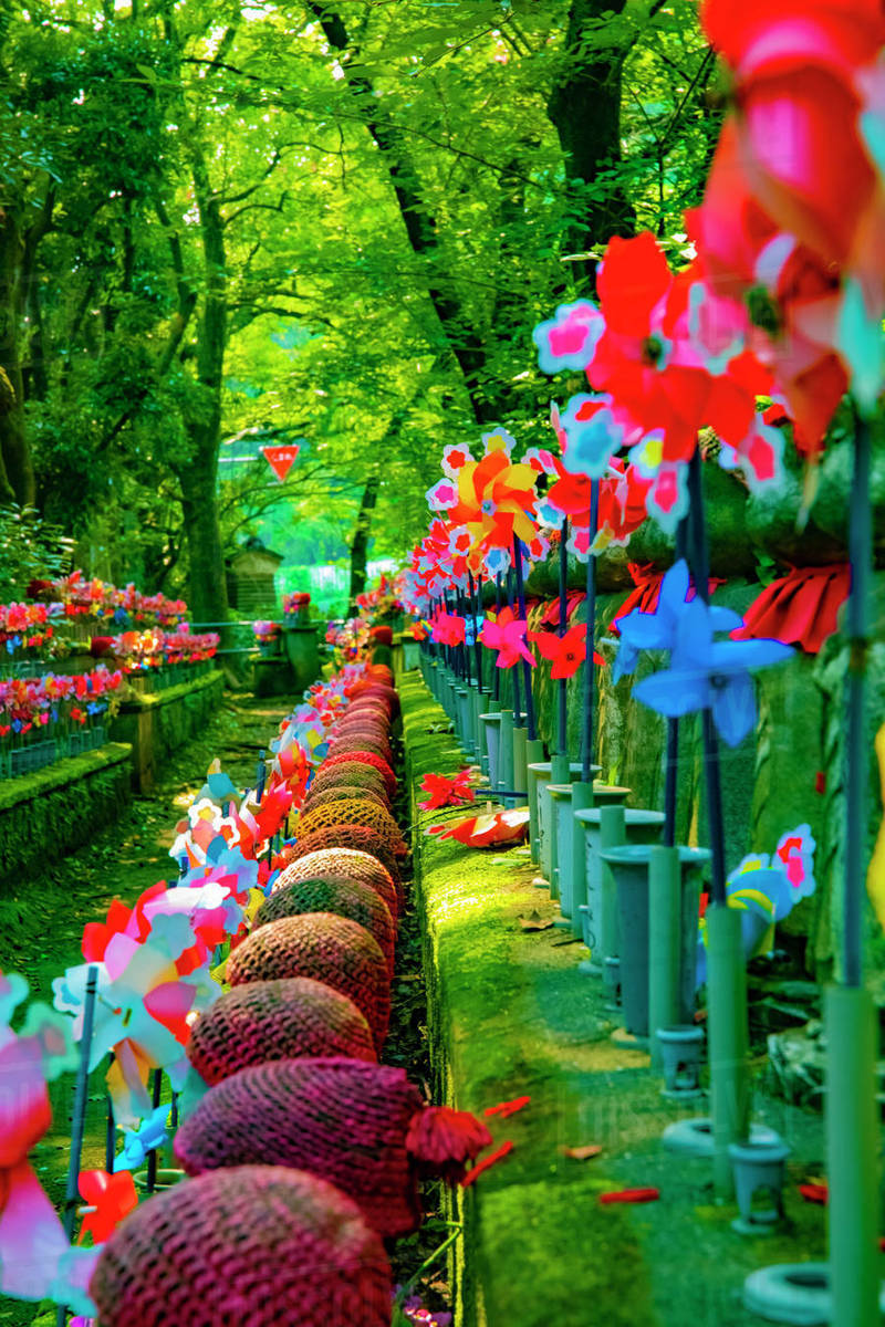 Statue guardian wearing red hat daytime. Minato district Tokyo Japan ...