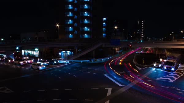 A night timelapse of the traffic jam at the crossing in Tokyo wide shot ...