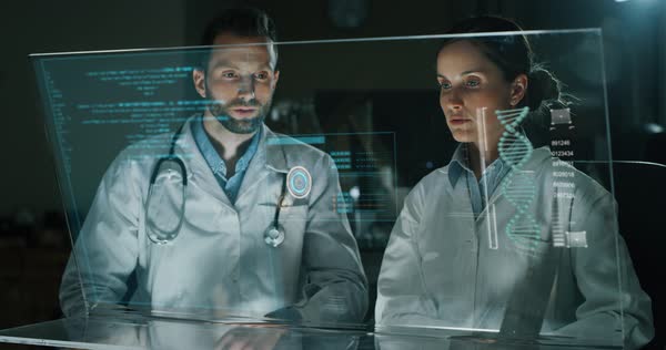 Slow motion of futuristic doctors using augmented reality screen with ...