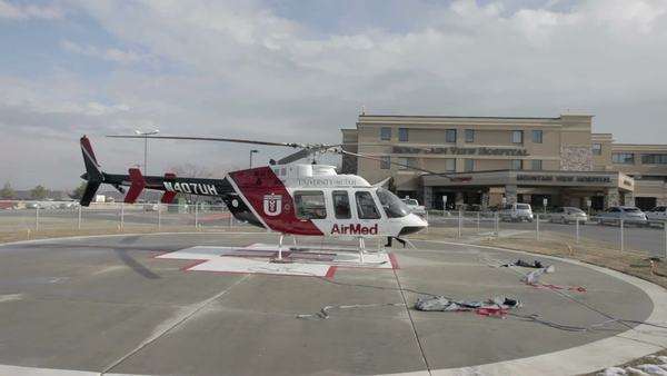 Helicopter AirMed pilot from University of Utah Medical Center getting ...