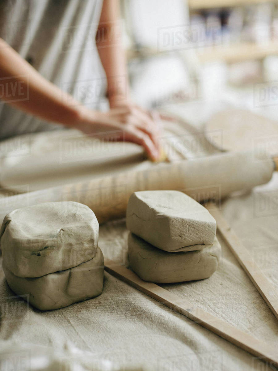 Female maker ceramics working with clay and creating a shape of ceramic ...