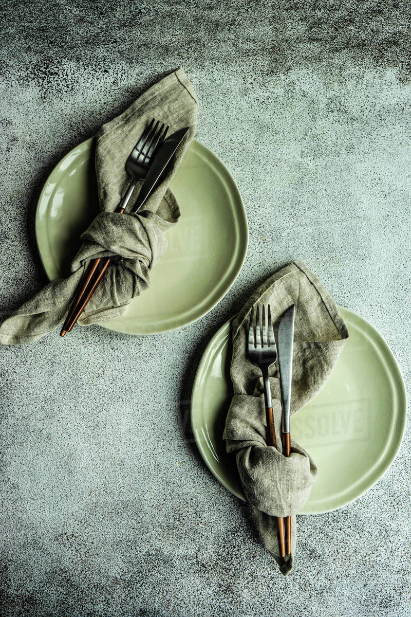 Overhead view of two minimalistic place settings on a table - Stock ...