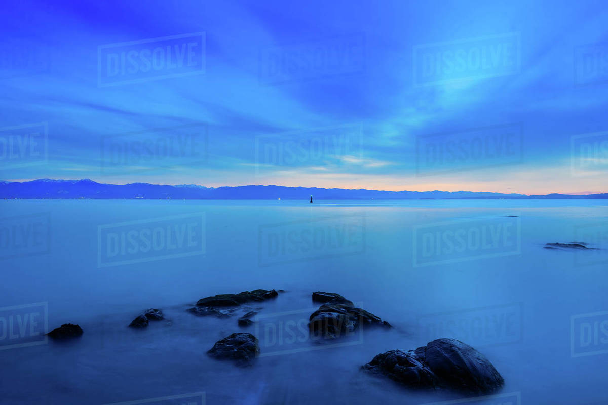 Costal rocks and seascape at dusk, Salish Sea, Victoria, British ...