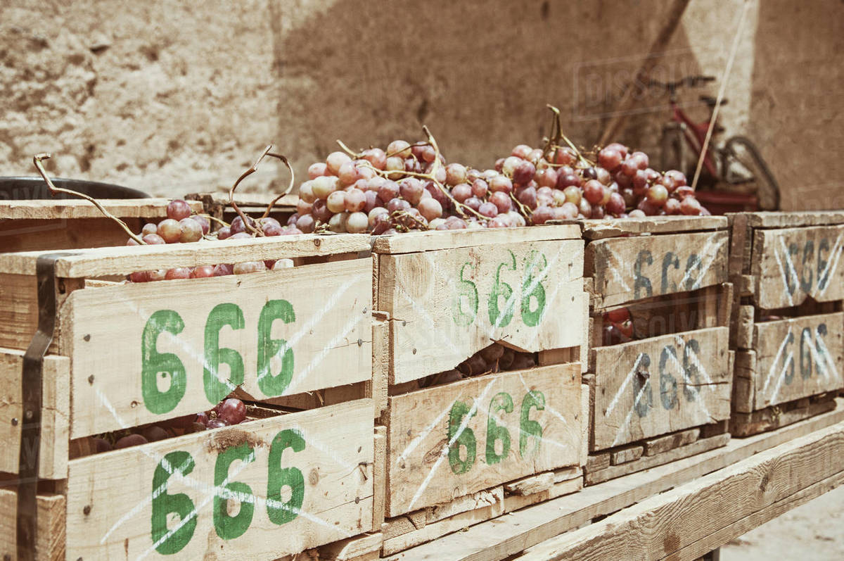Boxes full of red grapes at an outdoor market stall, Morocco - Royalty ...