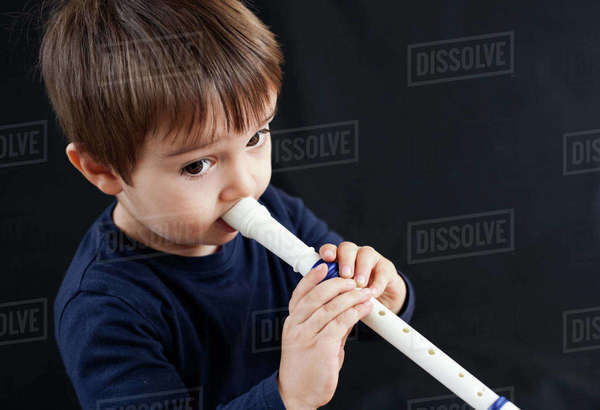 Boy playing a recorder - Royalty-free Stock Photo | Dissolve
