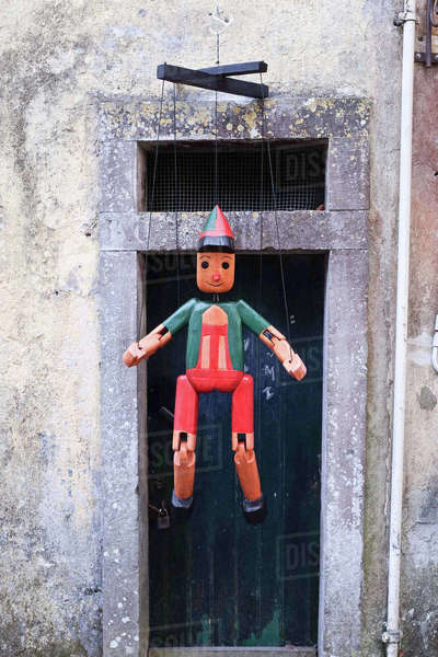 Traditional wooden puppet hanging outdoors - Royalty-free Stock Photo ...