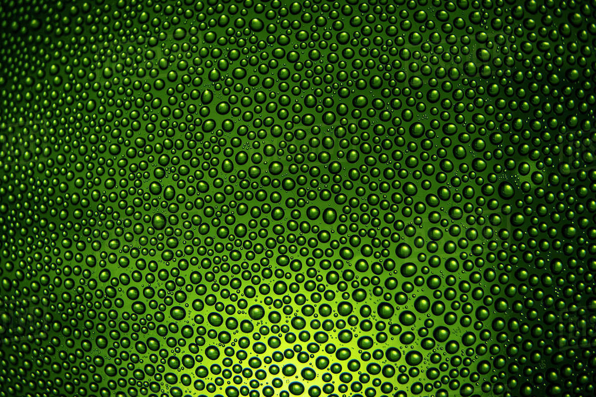 Water condensation droplets on a green plastic bottle - Royalty-free ...
