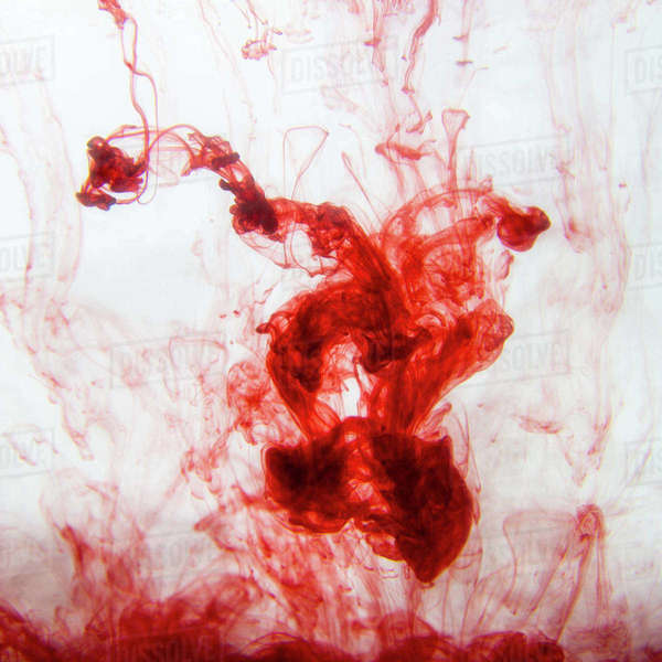 Red ink dissolving in water - Royalty-free Stock Photo | Dissolve