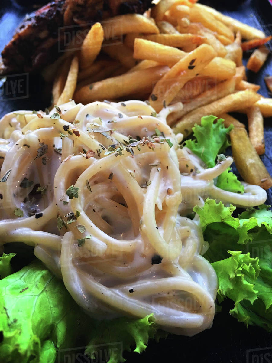 Grilled chicken, french fries and spaghetti in cream sauce - Royalty ...