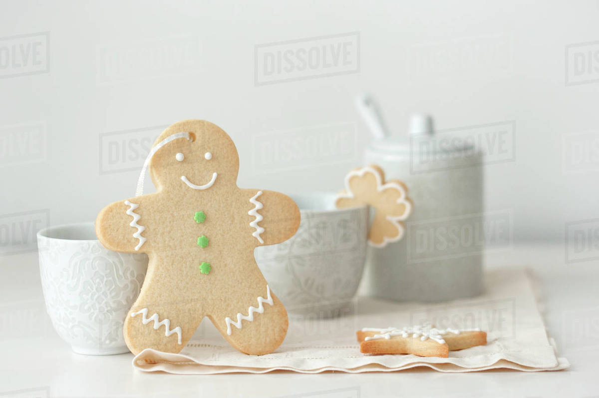 Gingerbread man cookie leaning against tea cup - Royalty-free Stock ...